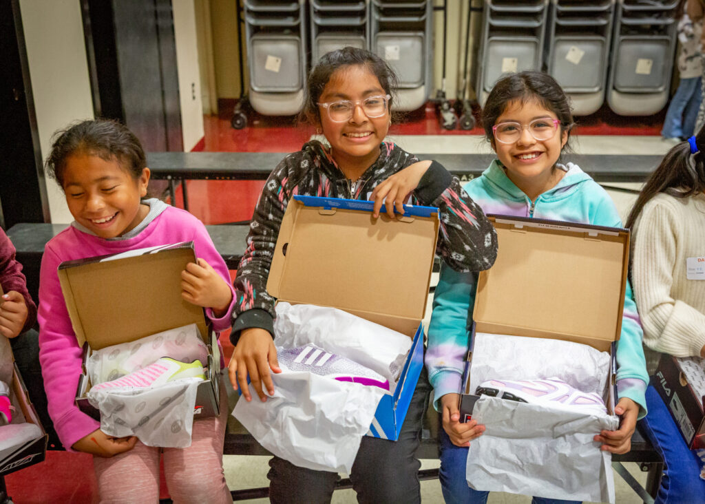 Tai Collins and A Chance for Children Give Shoes To 491 Kids in Los ...