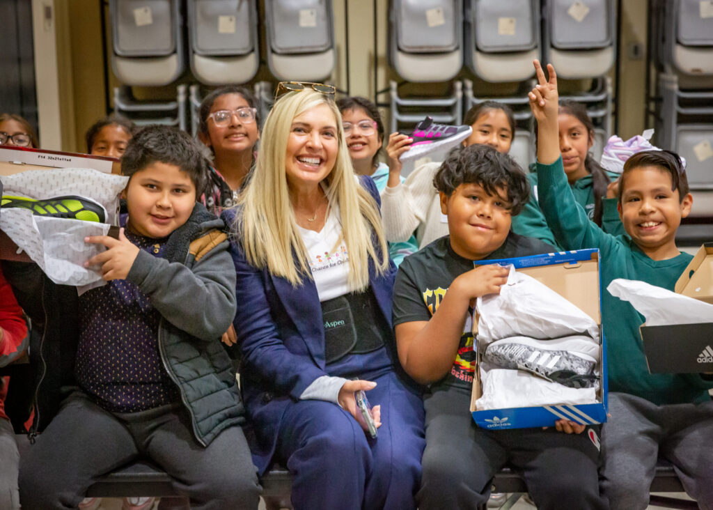Tai Collins and A Chance for Children Give Shoes To 491 Kids in Los ...